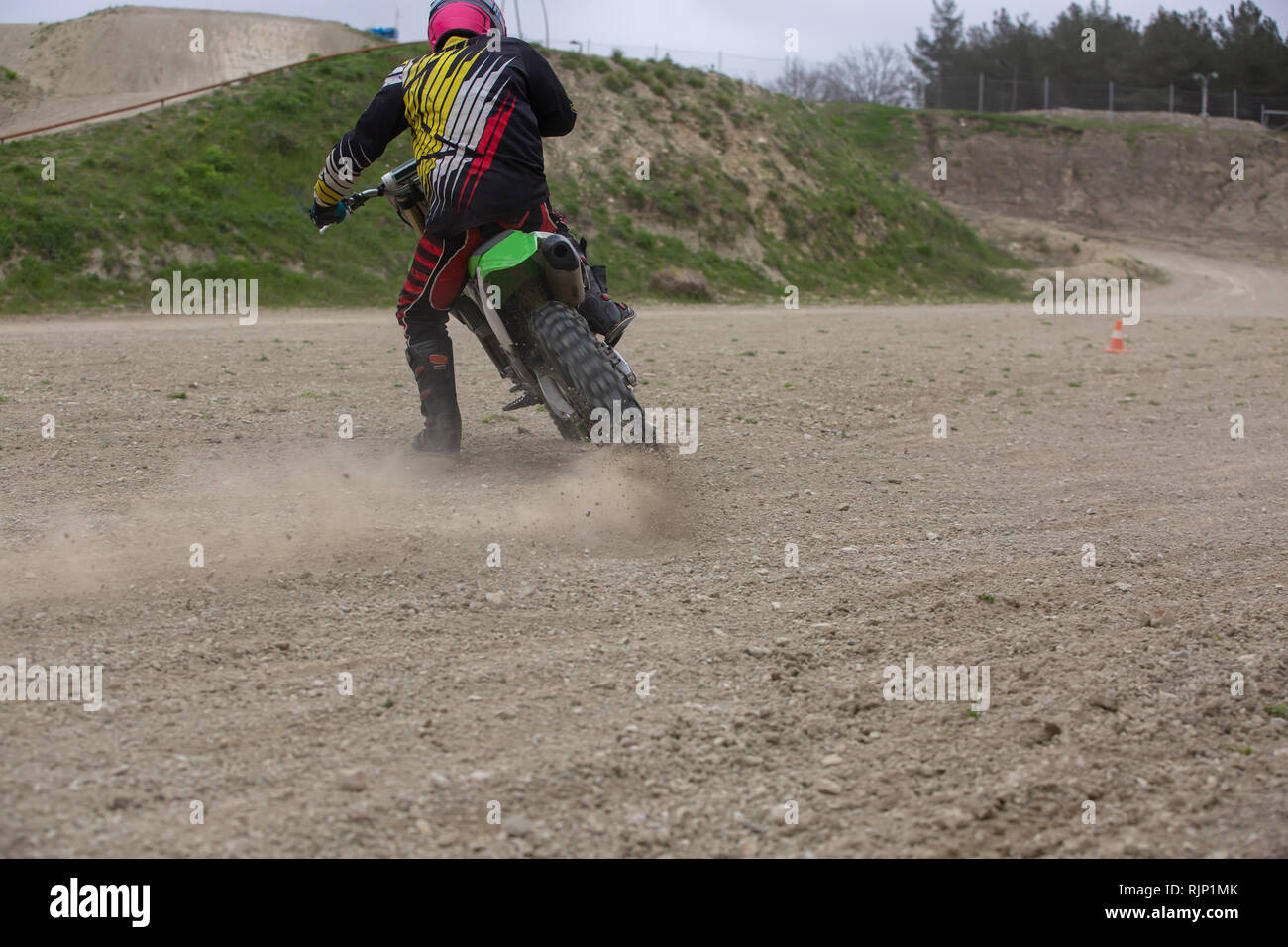 Professional motocross motorcycle rider driving hi-res stock ...