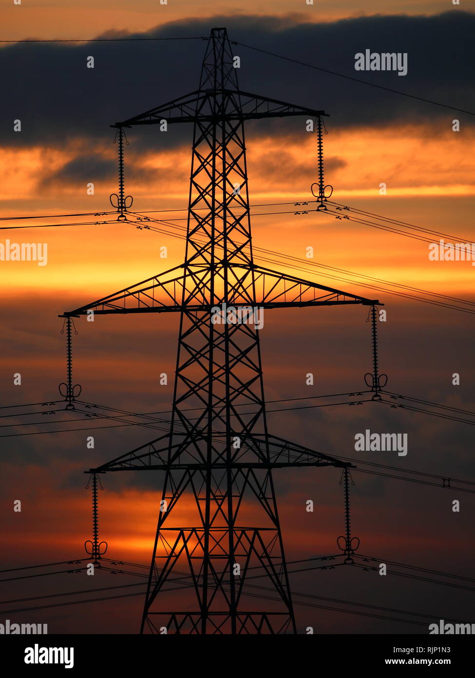 Golden sunset and Electricity Pylon Tower, Bedfordshire, England, UK ...