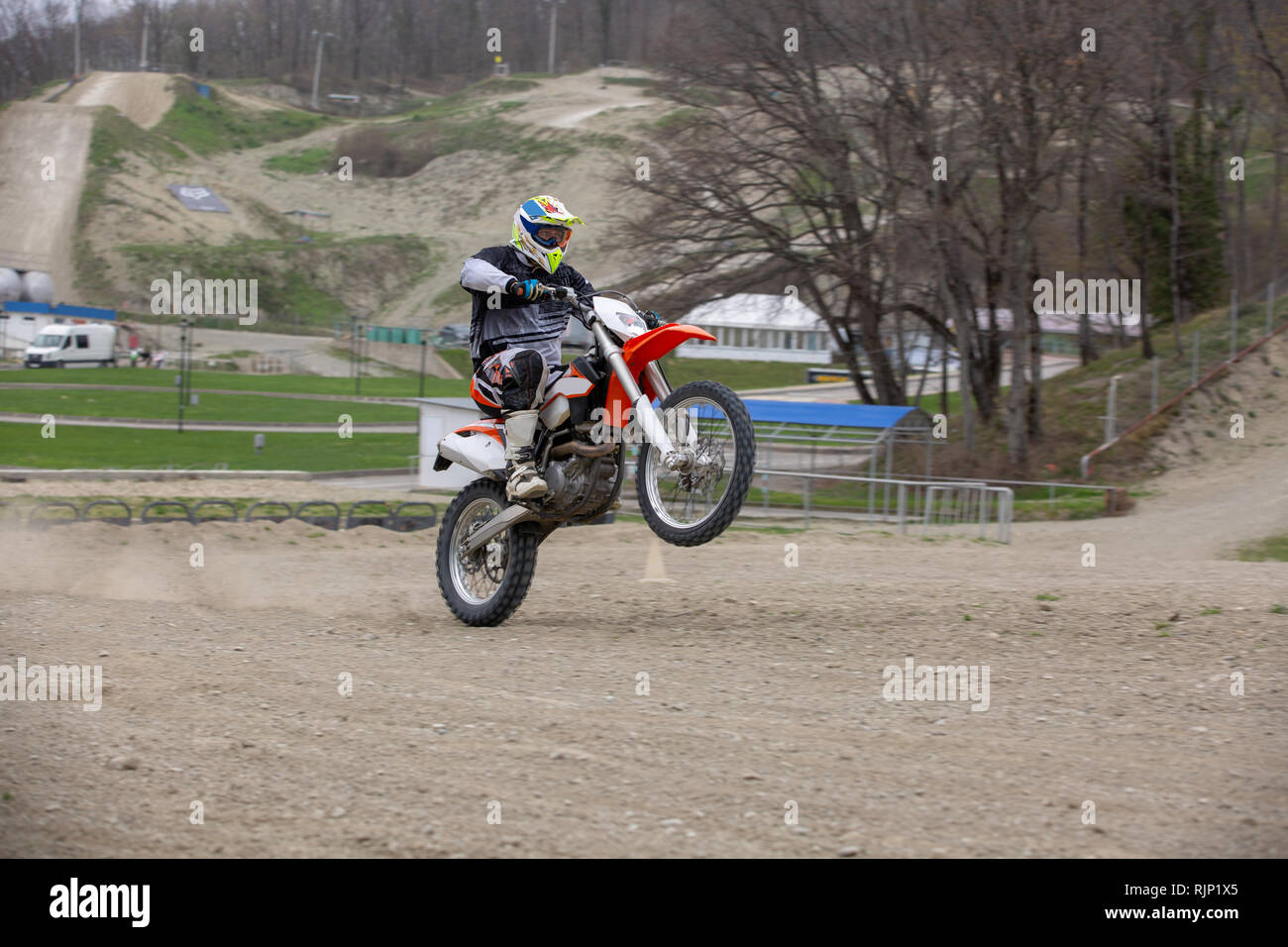 Professional motocross motorcycle rider driving hi-res stock ...