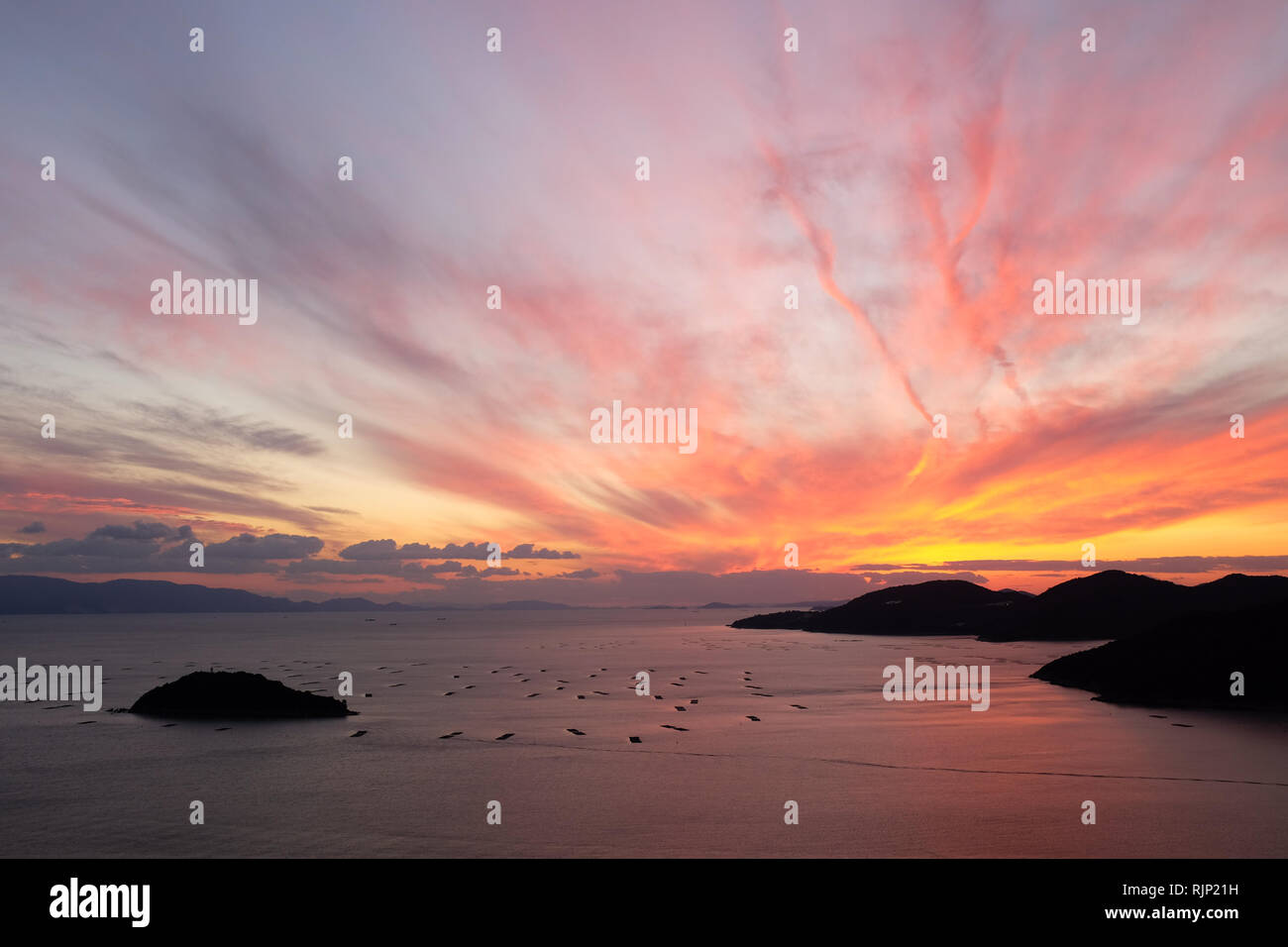 A sunset over Japan's Seto Inland Sea, also known as the Seto Naikai ...