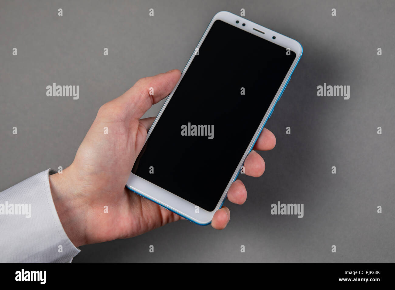 Man's hand holding black screen mobile phone Stock Photo - Alamy