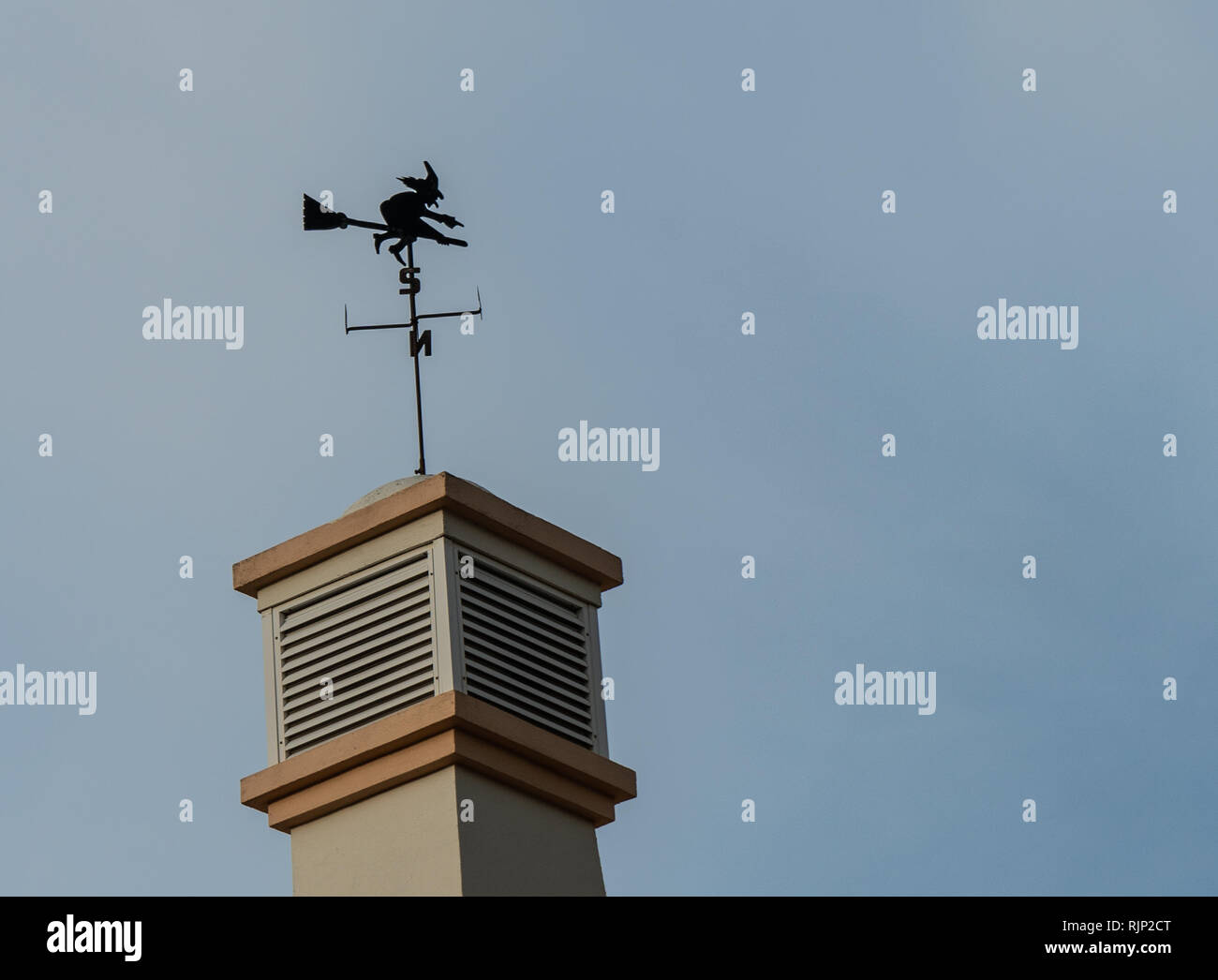witch weather vane in the sky Stock Photo - Alamy
