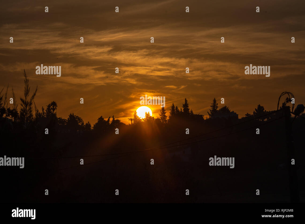 sunset over the hill Stock Photo - Alamy