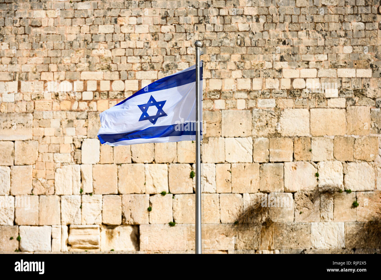 (focus on the flag) Close-up view of the Israeli flag waved by the wind ...