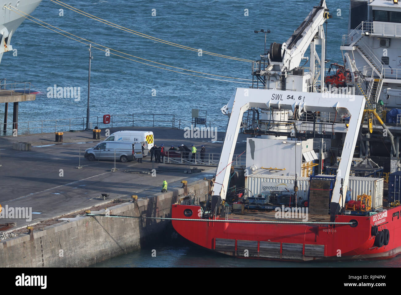 A stretcher carrying a body is removed from the Geo Ocean III ...