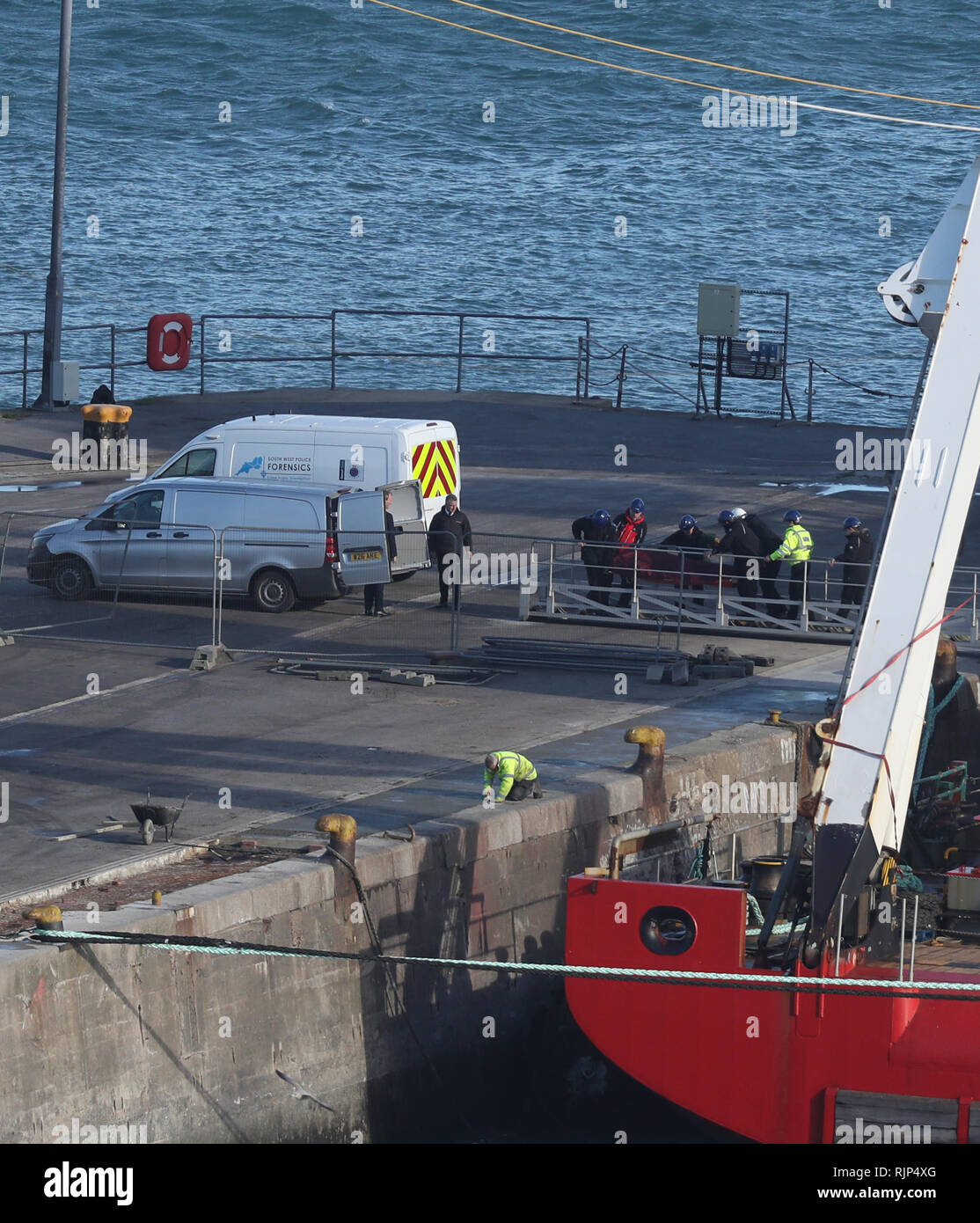 A stretcher carrying a body is removed from the Geo Ocean III ...