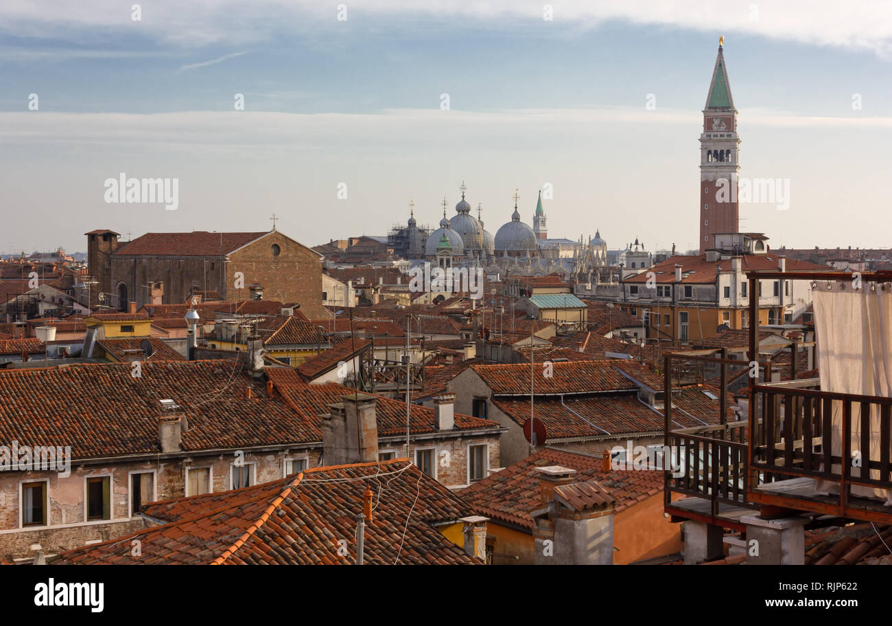 View on the roofs of Venice, Italy, with the Saint Mark's basilica in ...