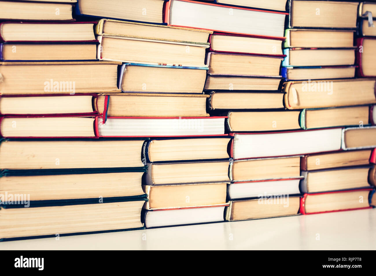 Stack of books education concept background, many books piles with copy ...