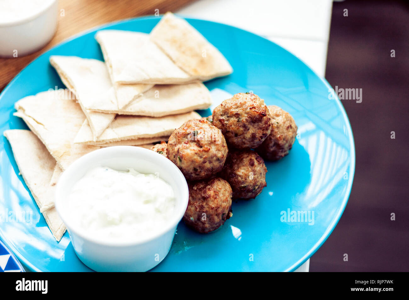 Fried minced meat with sauce and tortillas, traditional Greek lunch on ...