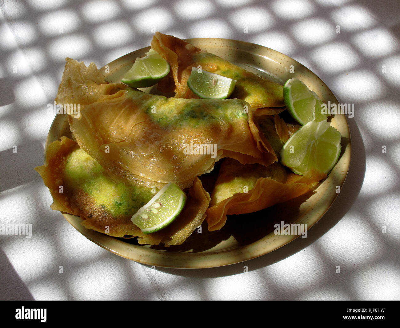 Traditional Tunisian food, brik fried pasteries with egg or some other ...