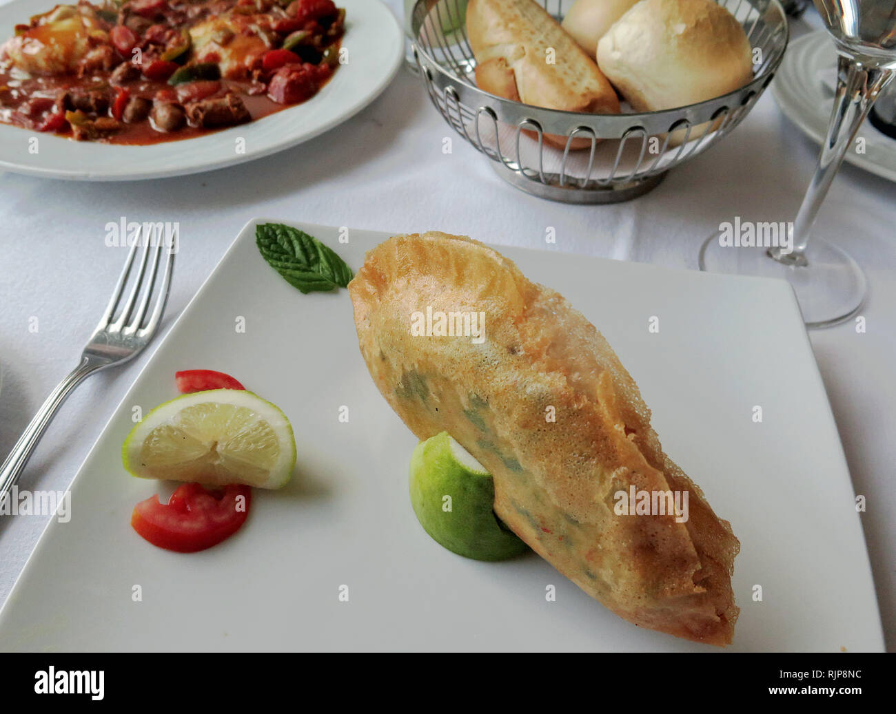 Traditional Tunisian food, brik fried pasteries with egg or some other ...