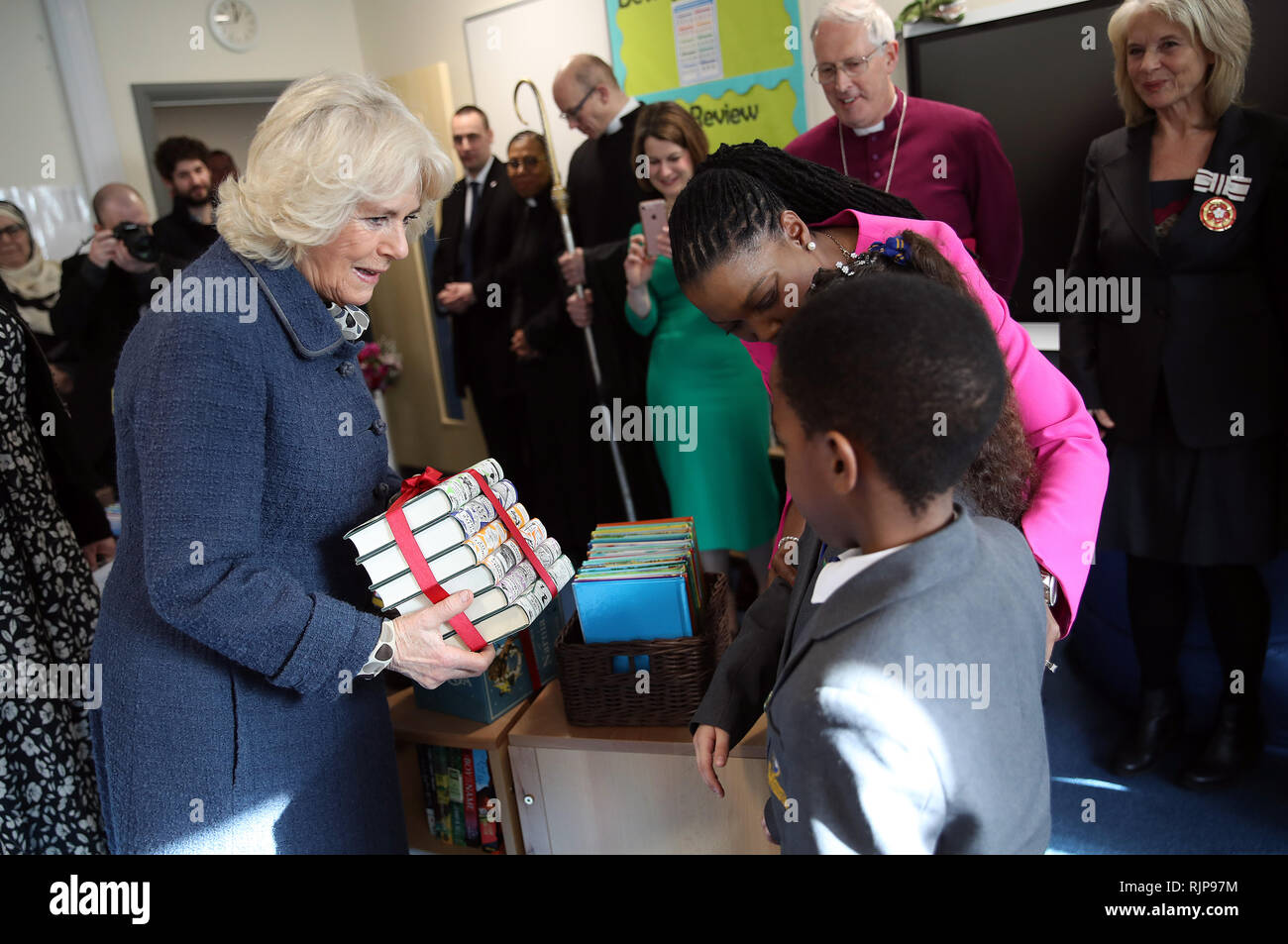 The Duchess of Cornwall gives new school books during her visit to St ...