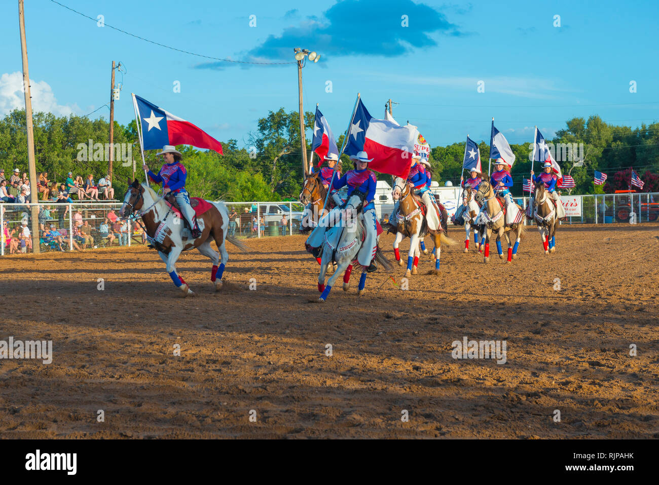 Lone Star Cowgirls entertaining a Texas Pro Rodeo Crowd Stock Photo - Alamy
