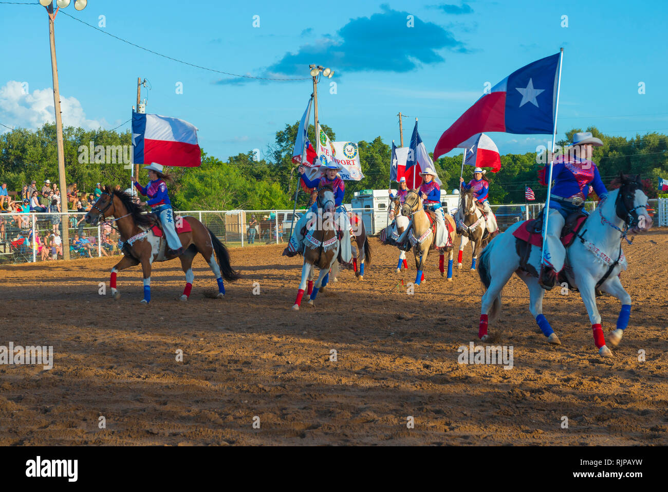 Lone Star Cowgirls entertaining a Texas Pro Rodeo Crowd Stock Photo - Alamy