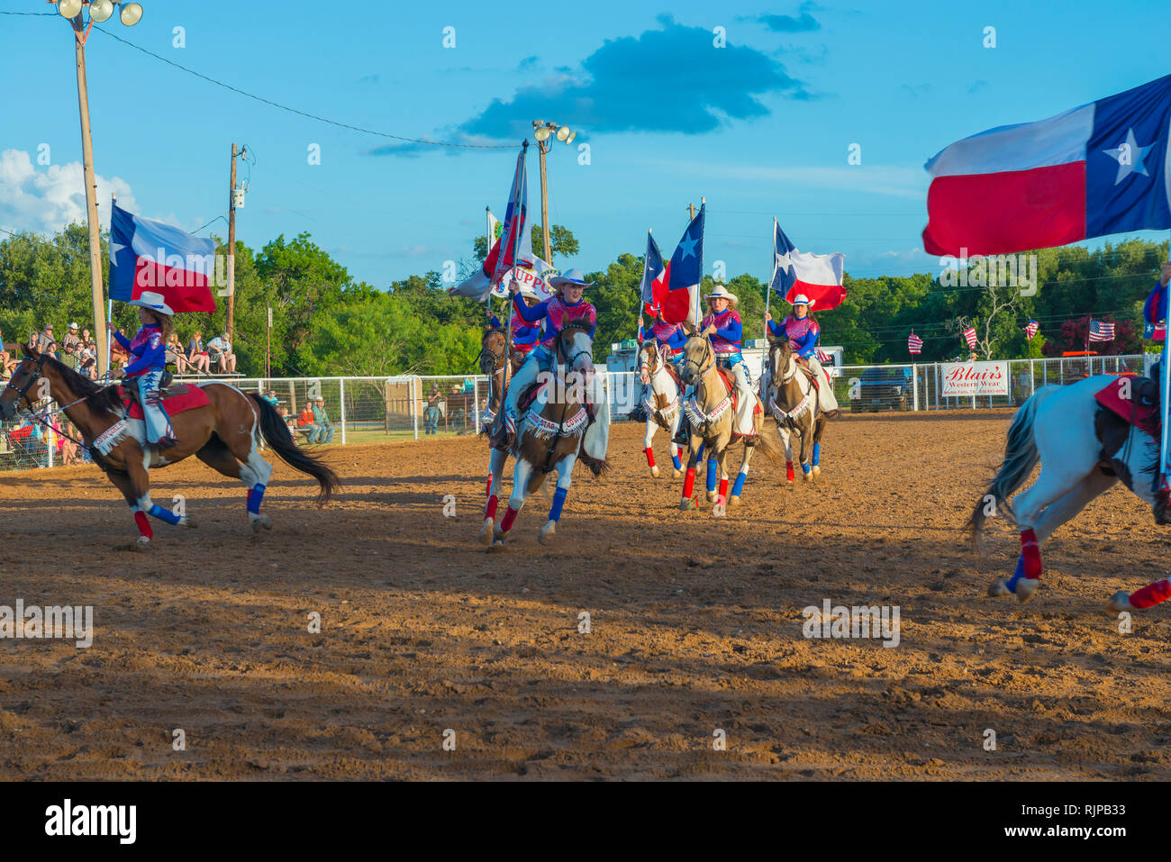 Lone Star Cowgirls entertaining a Texas Pro Rodeo Crowd Stock Photo - Alamy