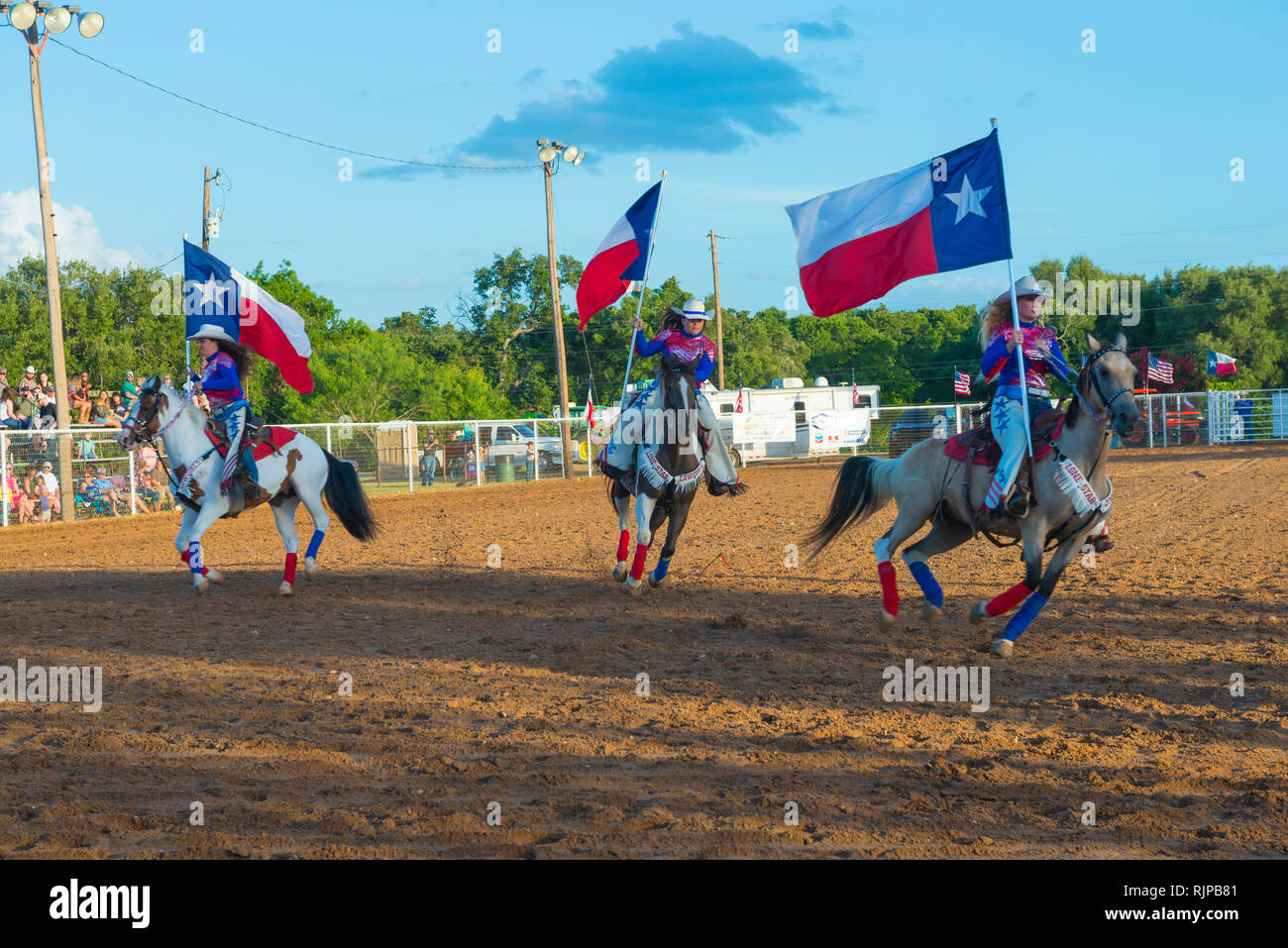 Lone Star Cowgirls entertaining a Texas Pro Rodeo Crowd Stock Photo - Alamy