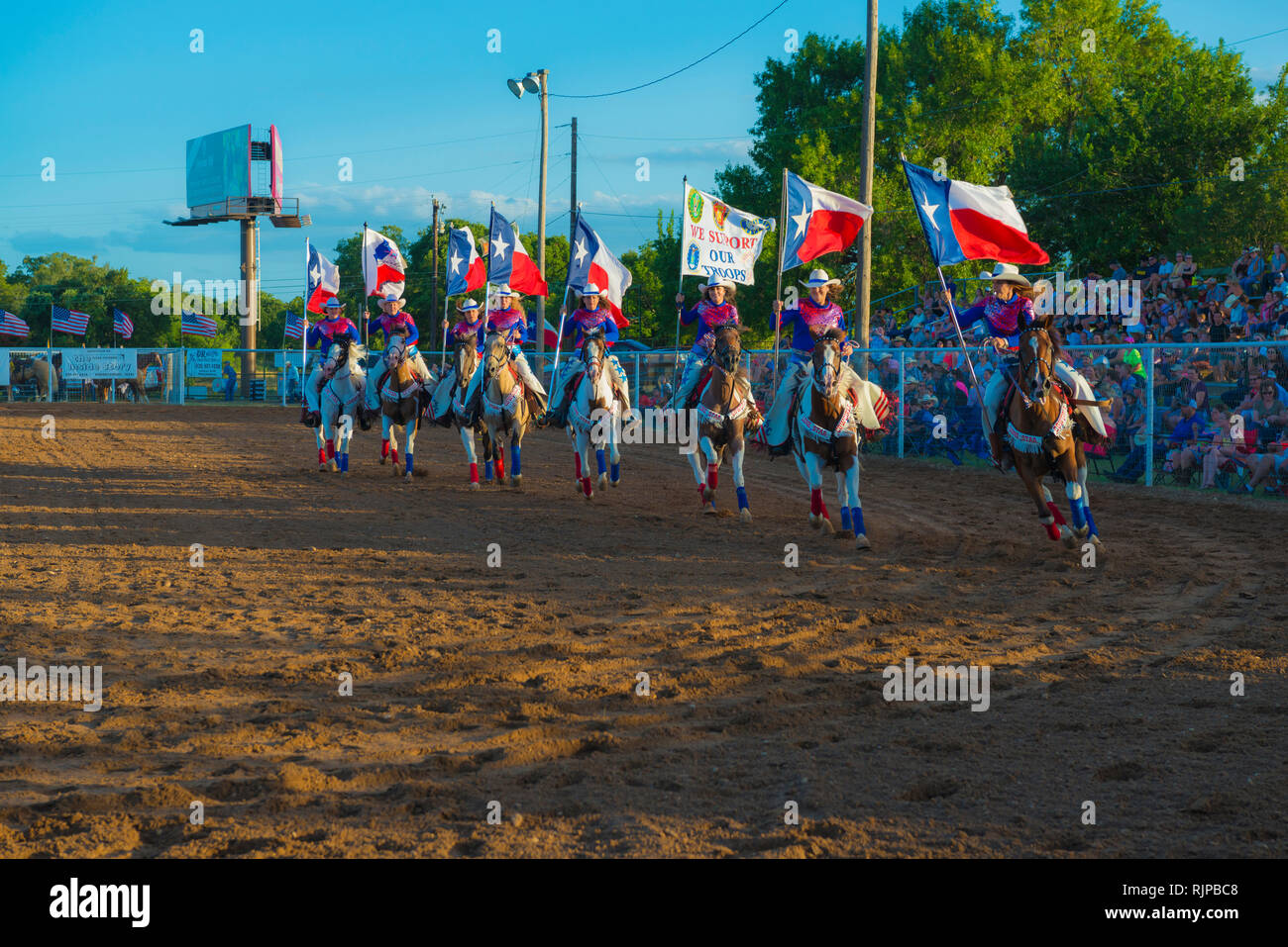 Lone Star Cowgirls entertaining a Texas Pro Rodeo Crowd Stock Photo - Alamy