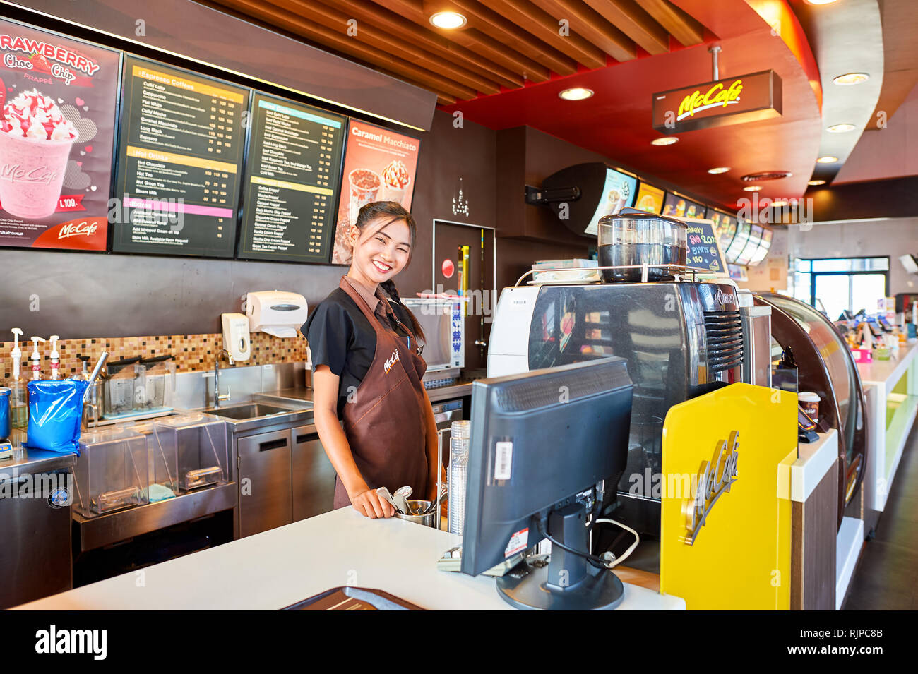 PATTAYA, THAILAND - FEBRUARY 21, 2016: worker at McCafe in Thailand ...