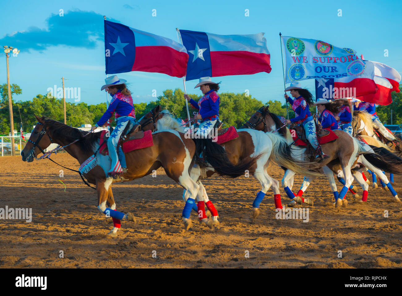 Lone Star Cowgirls entertaining a Texas Pro Rodeo Crowd Stock Photo - Alamy