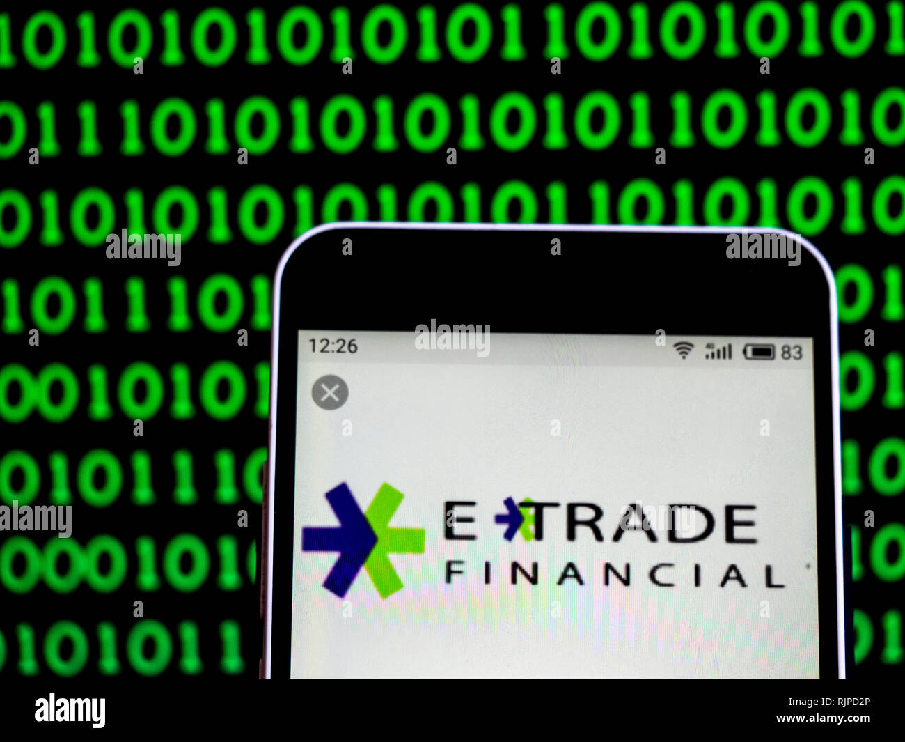 E-Trade Financial services company logo seen displayed on smart phone ...