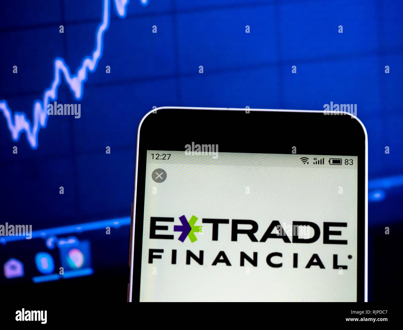 E-Trade Financial services company logo seen displayed on smart phone ...