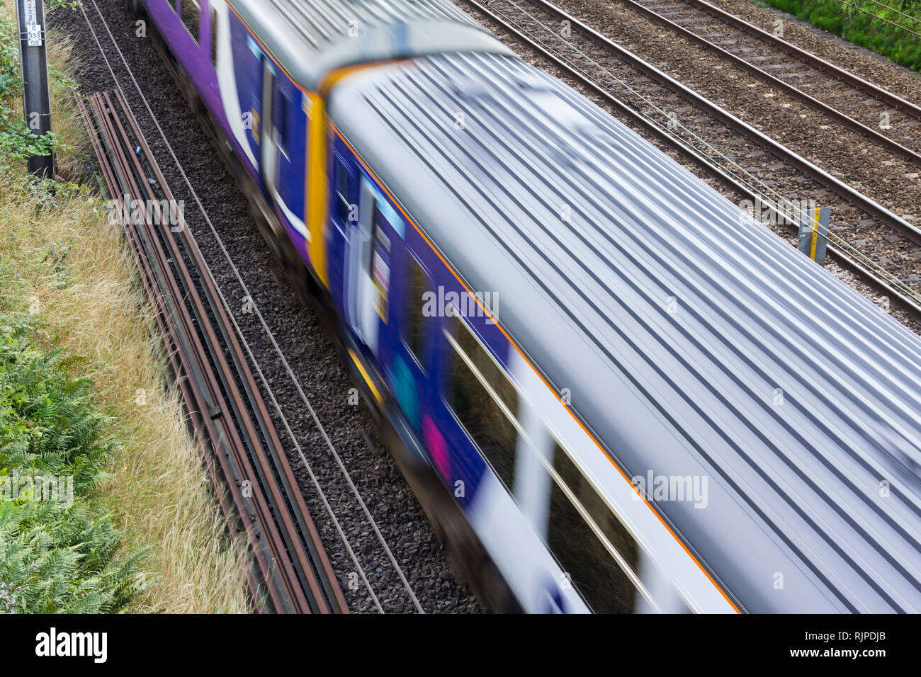 Northern Rail class 156 Sprinter diesel multiple unit train passing at speed with motion blur ...