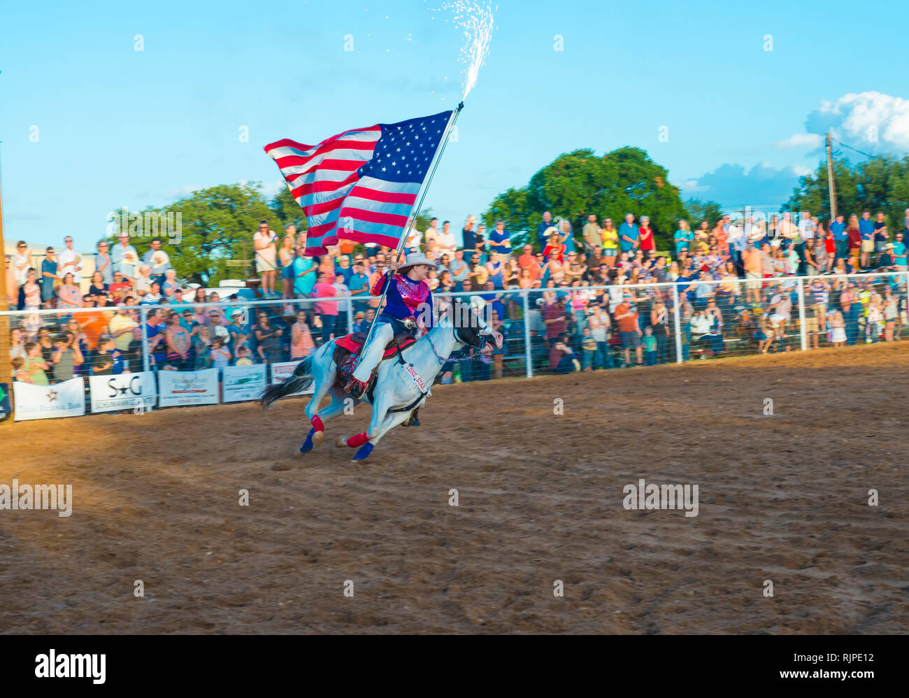 Lone Star Cowgirls entertaining a Texas Pro Rodeo Crowd Stock Photo - Alamy
