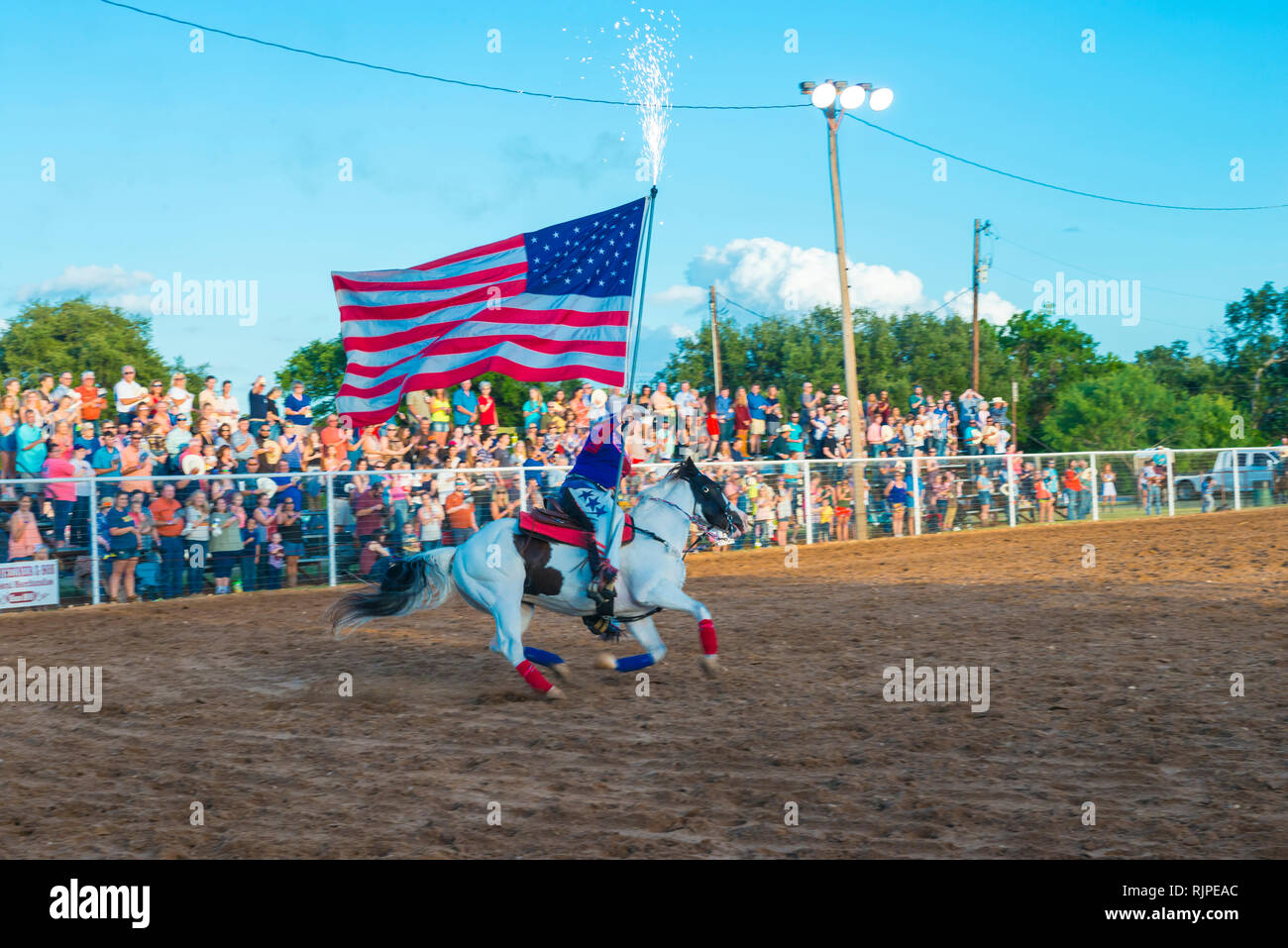 Lone Star Cowgirls entertaining a Texas Pro Rodeo Crowd Stock Photo - Alamy