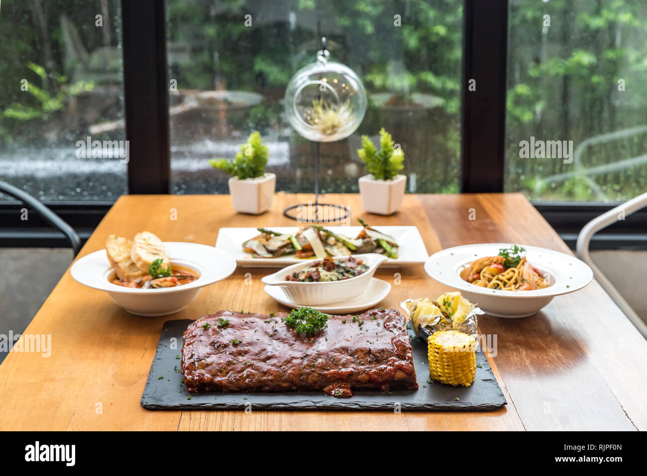 dining table with food ready to eat Stock Photo - Alamy