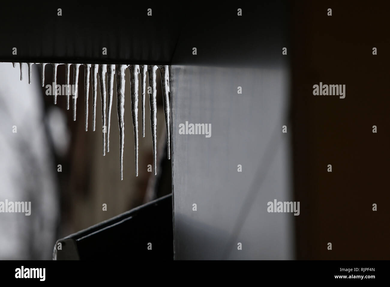 Hanging icicles after a freezing rain weather phenomenon Stock Photo ...