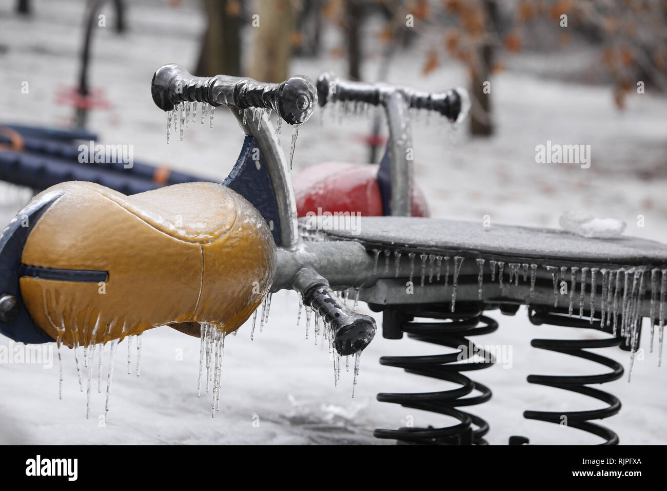 Frozen children playground after a freezing rain weather phenomenon ...