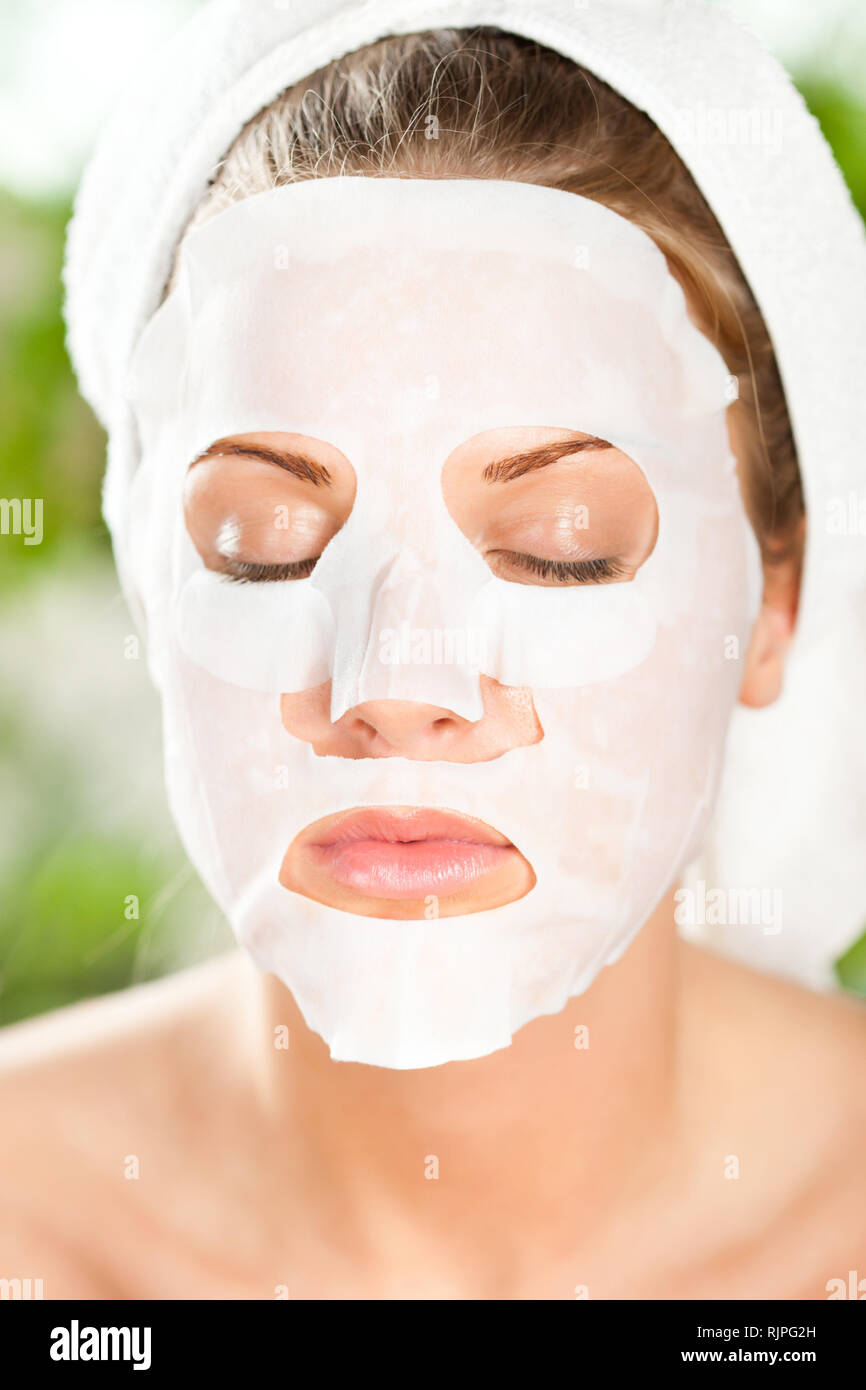 Young woman with skin mask on her face Stock Photo - Alamy