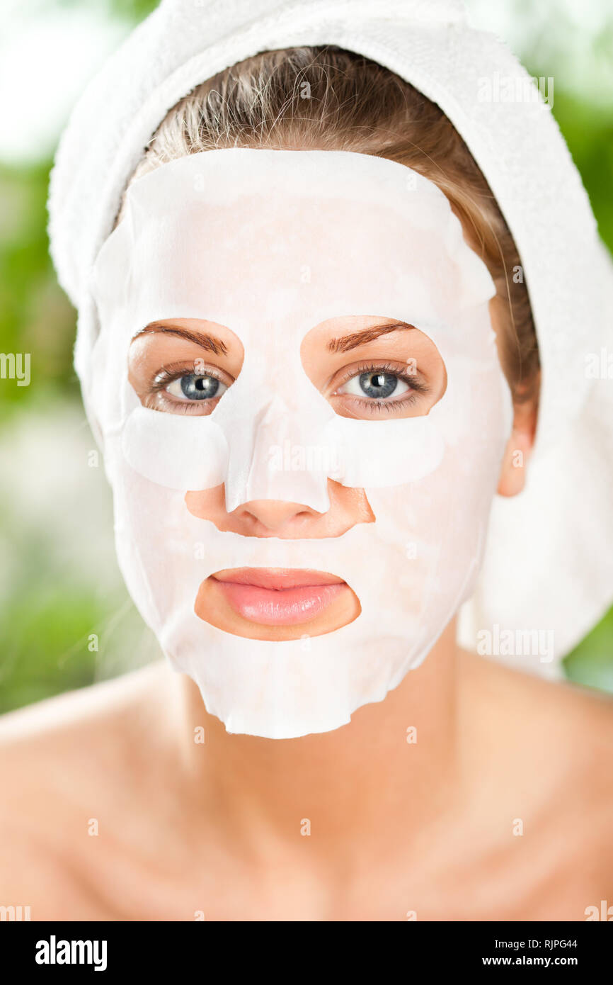 Young woman with skin mask on her face Stock Photo - Alamy