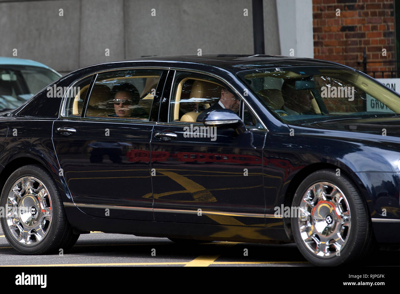 Princess Anne is driven through central London by police motorcycle ...