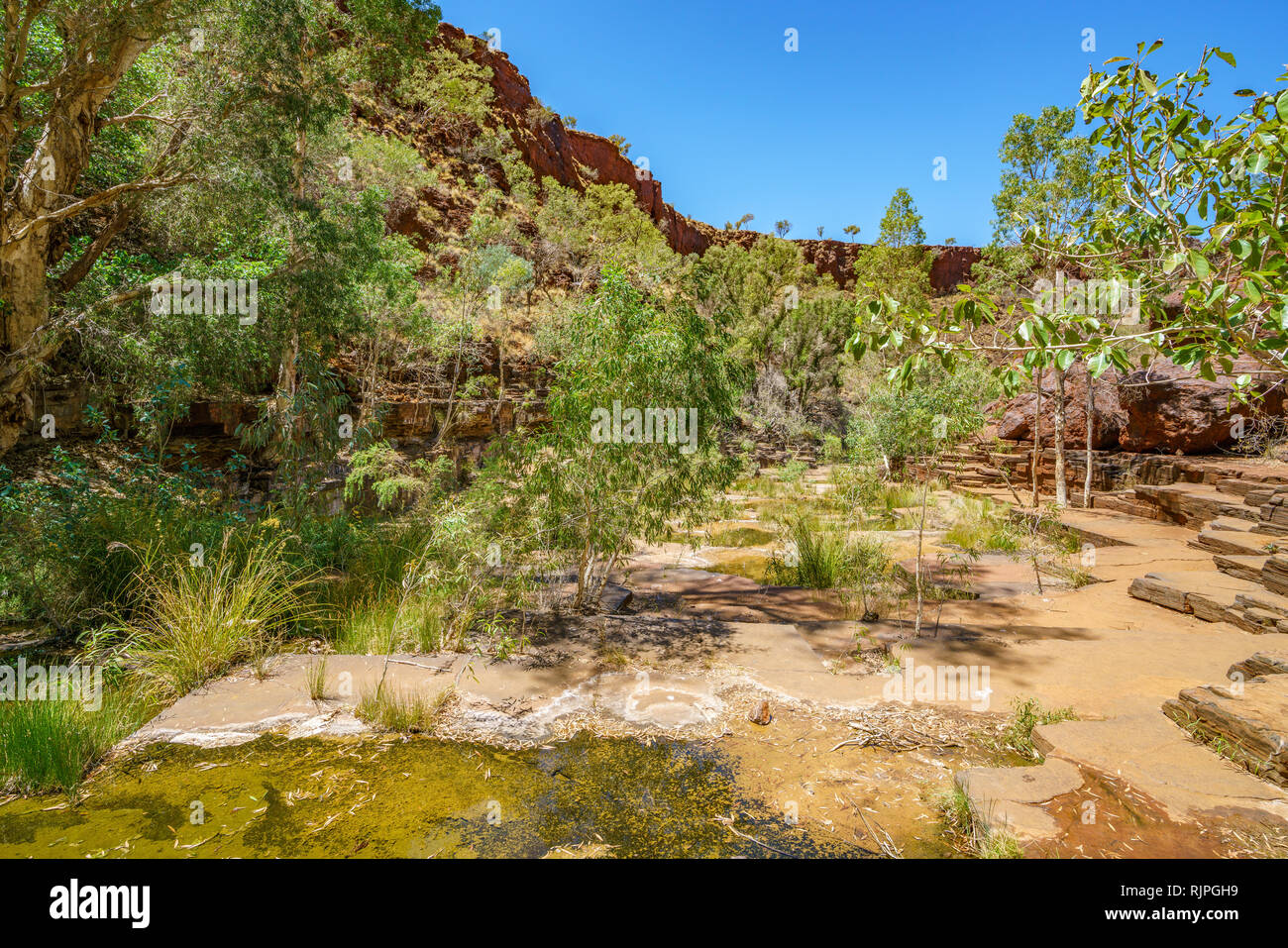 hiking over rocks in dales gorge, karijini national park, western ...