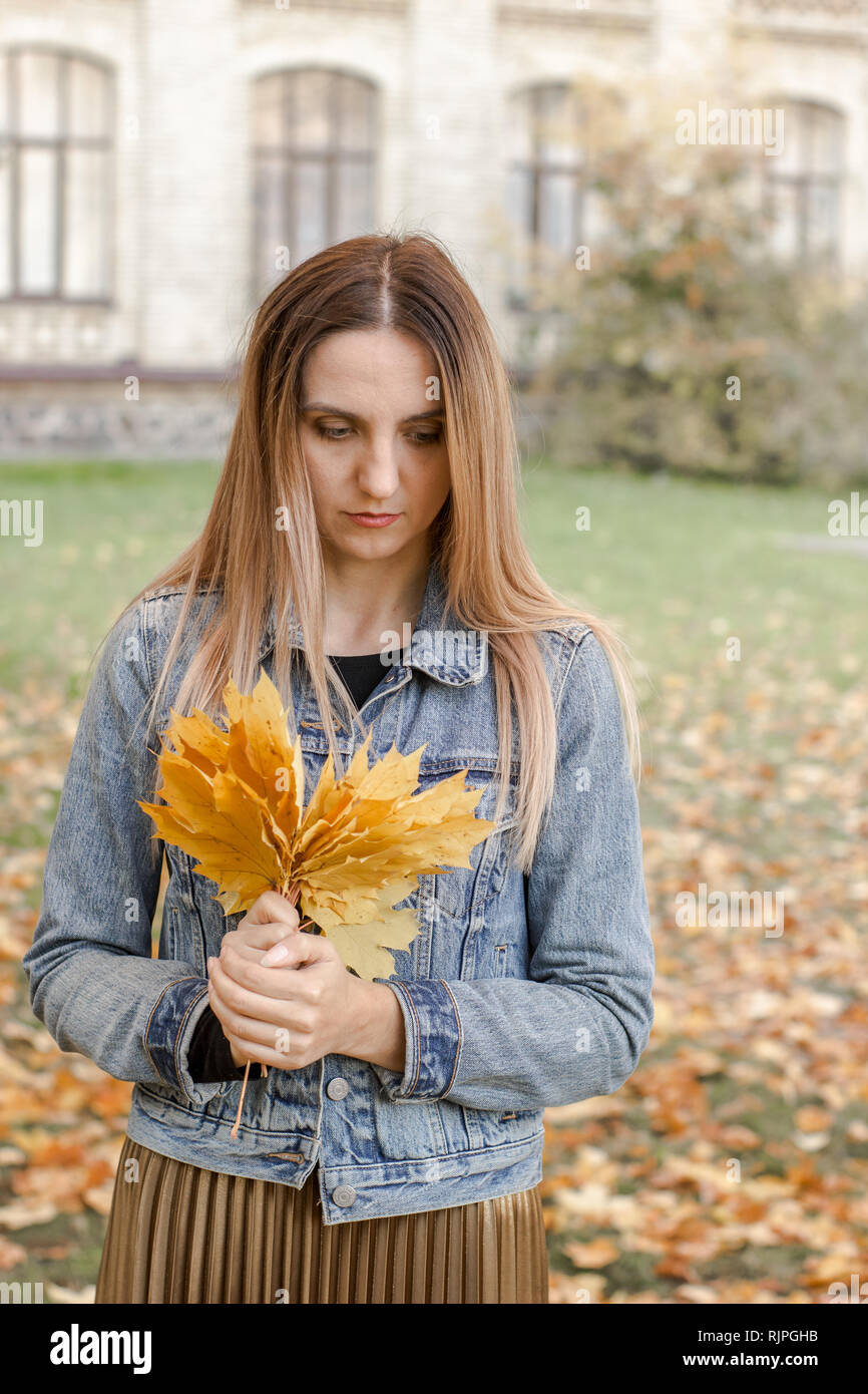 Warm atmospheric lifestyle photo of a sad woman Stock Photo - Alamy