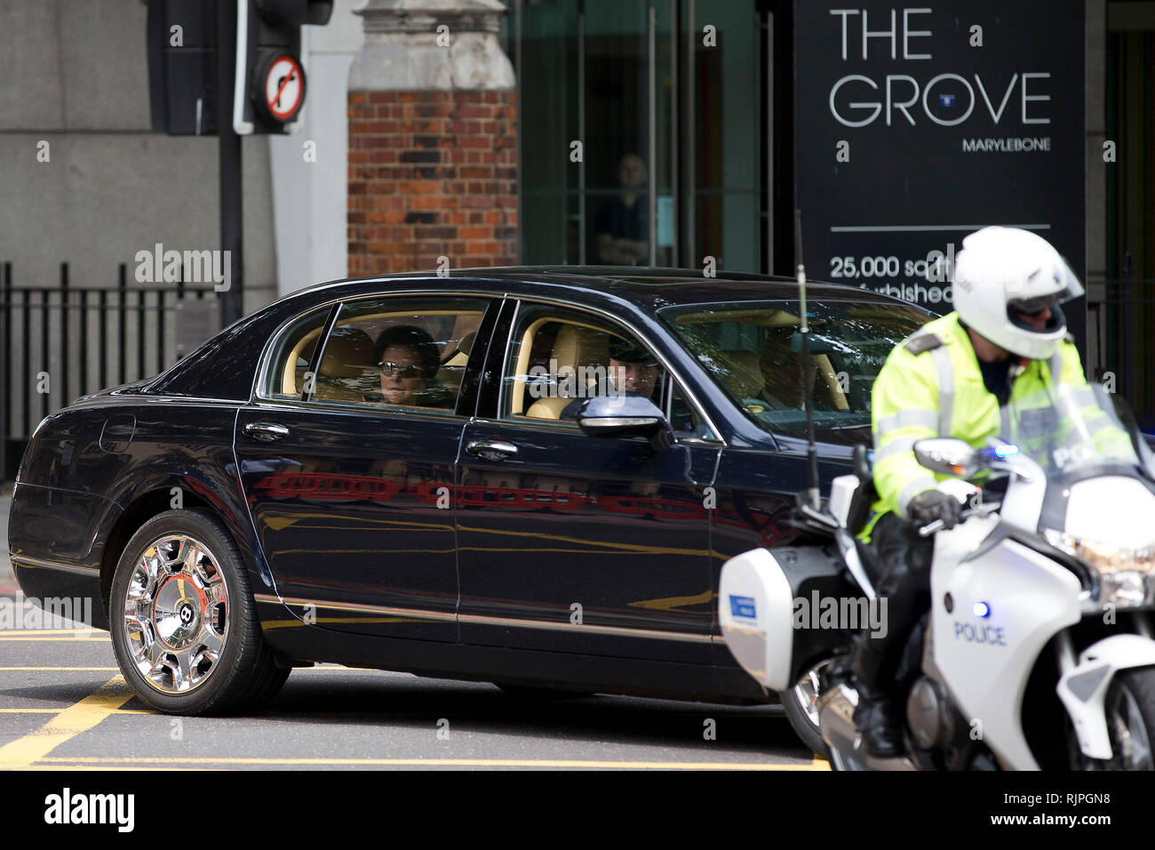 Princess Anne is driven through central London by police motorcycle ...