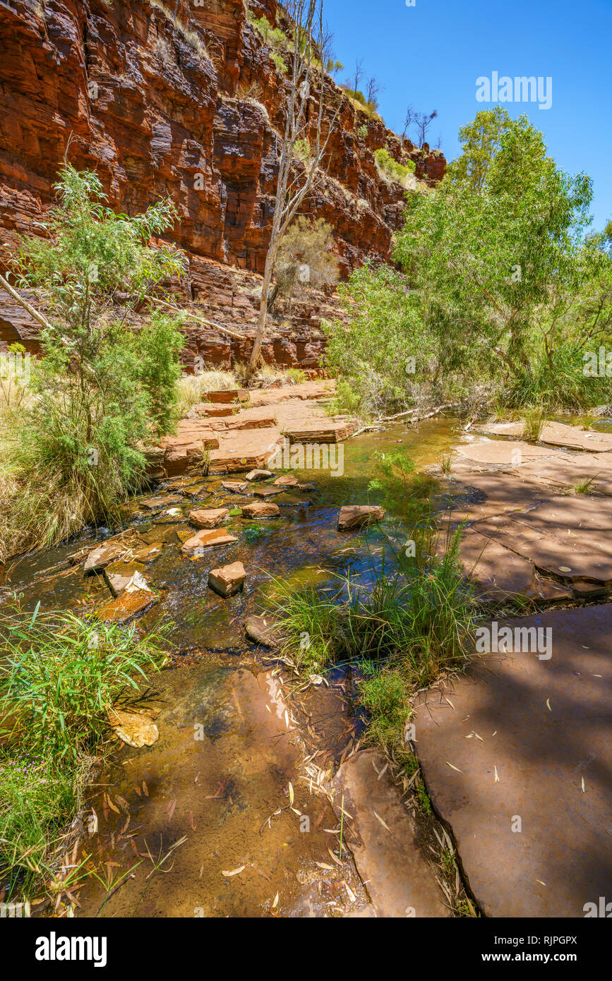 hiking over rocks in dales gorge, karijini national park, western ...