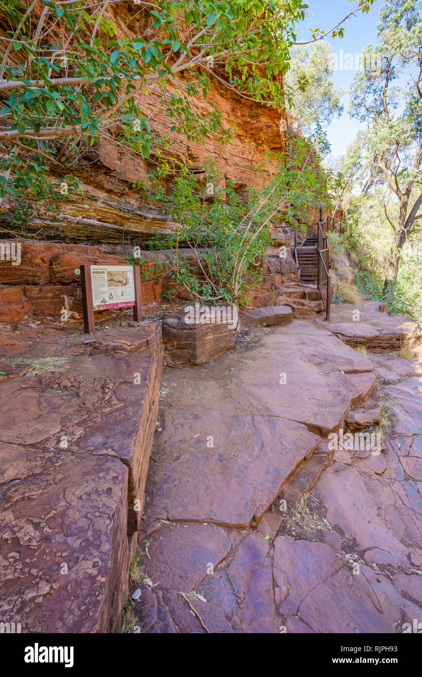 hiking over rocks in dales gorge, karijini national park, western ...