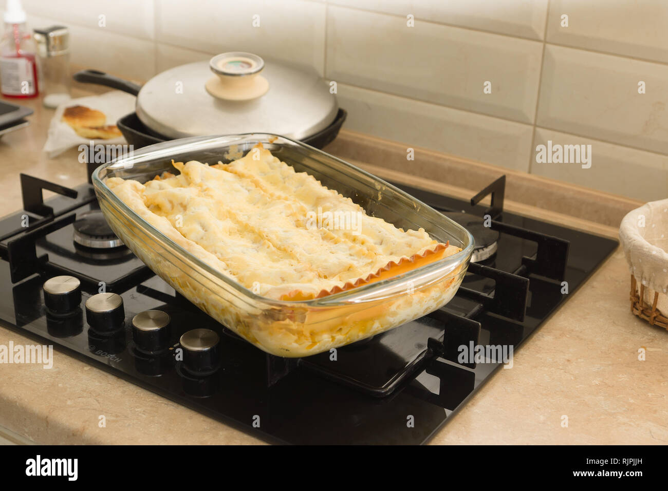 fresh lasagna extracted from the oven in a glass container Stock Photo ...