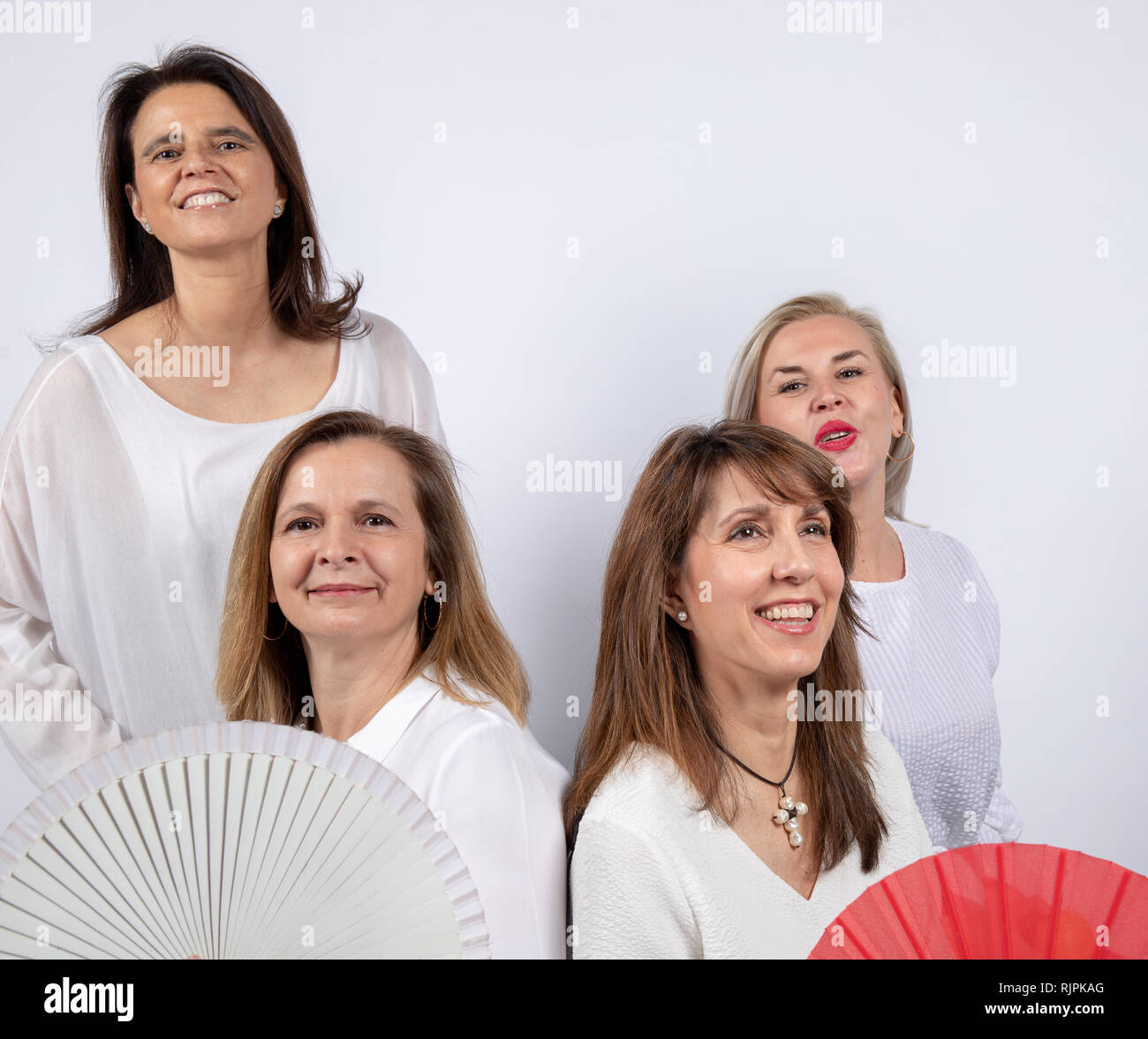 Group of 4 women, friends, middle-aged having fun in a photo session in ...