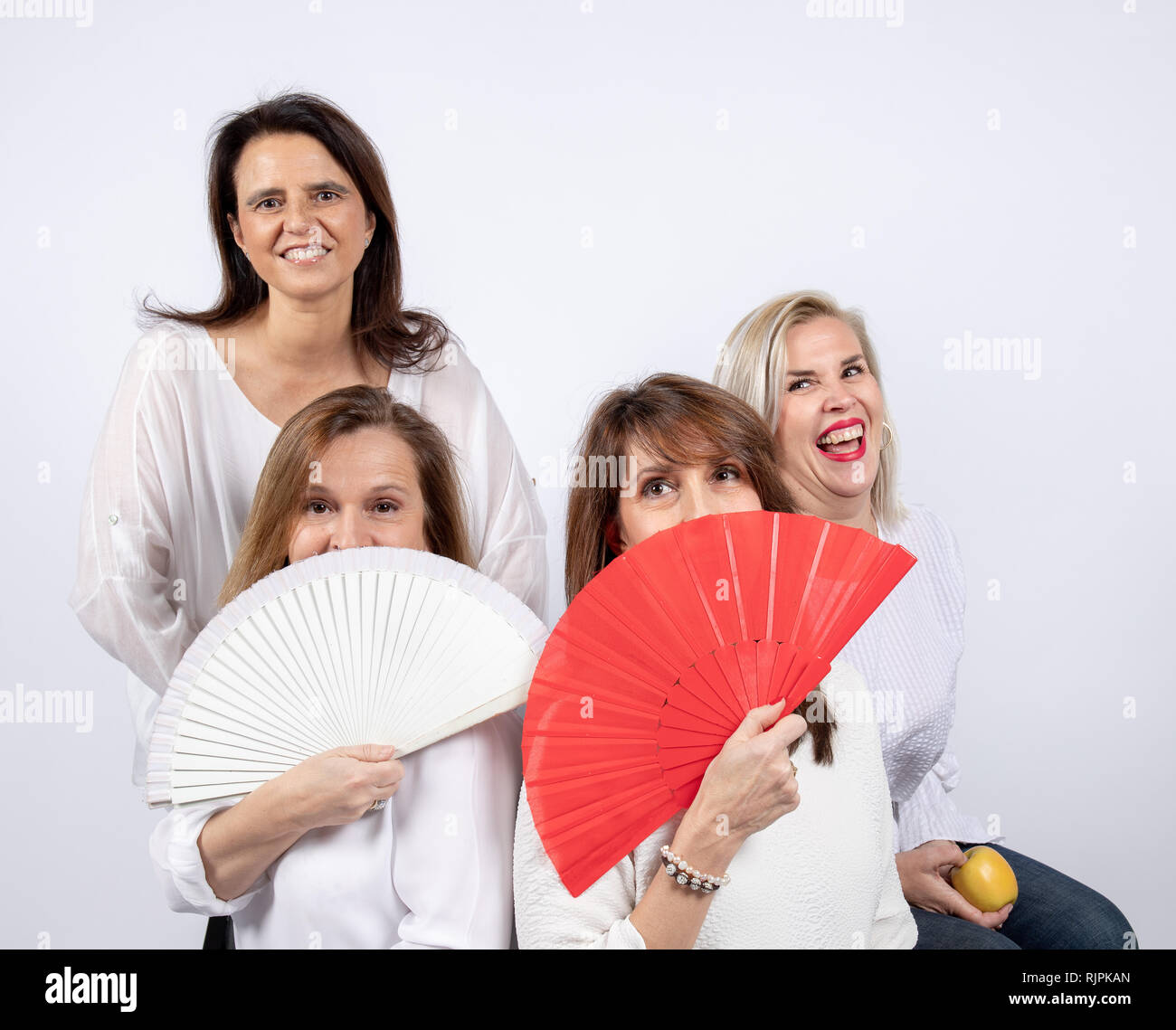 Group of 4 women, friends, middle-aged having fun in a photo session in ...
