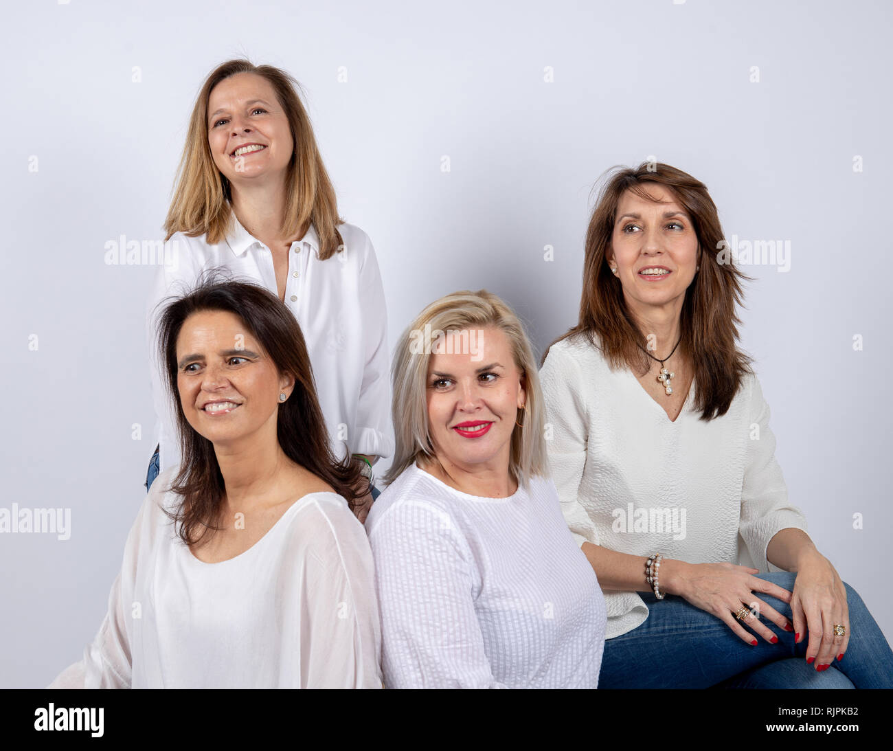 Group of 4 women, friends, middle-aged having fun in a photo session in ...