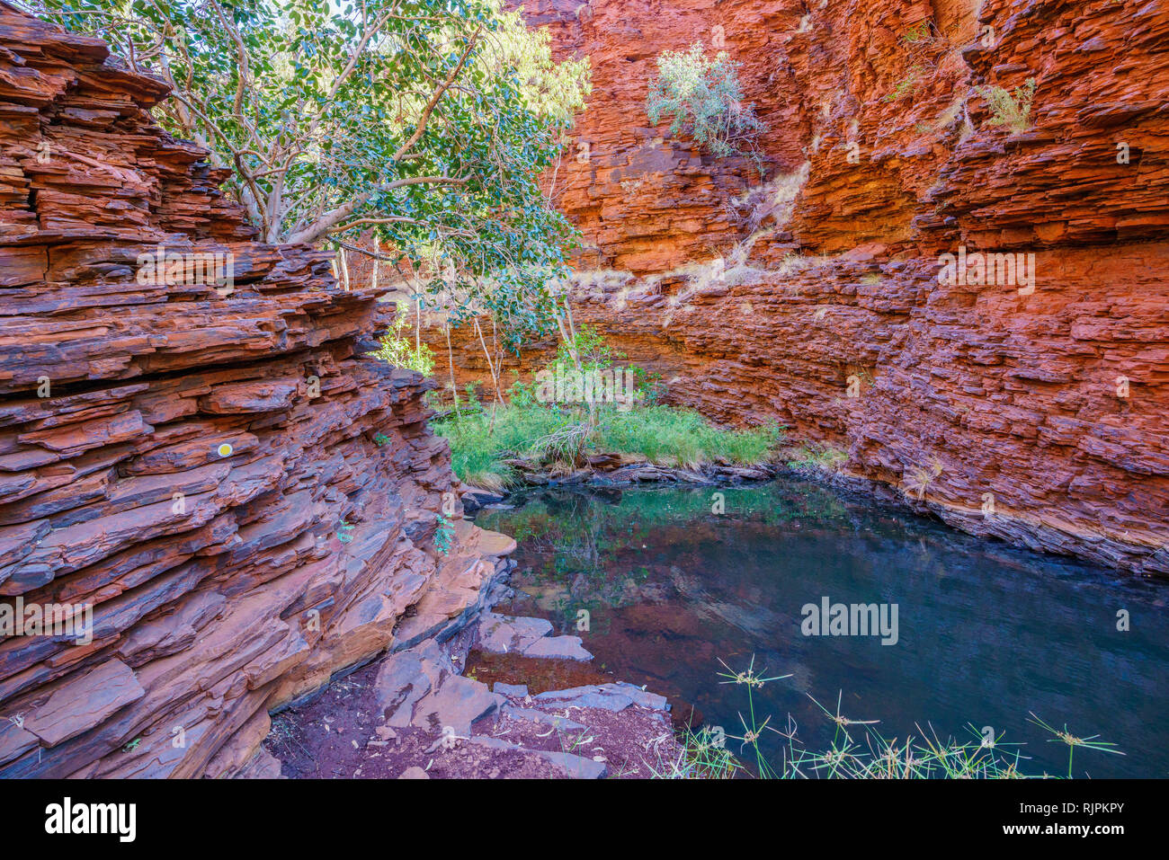 hiking down in the deep and narrow weano gorge in karijini national ...
