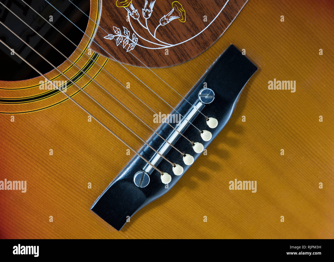 red western guitar music instrument with the strings in close up Stock ...