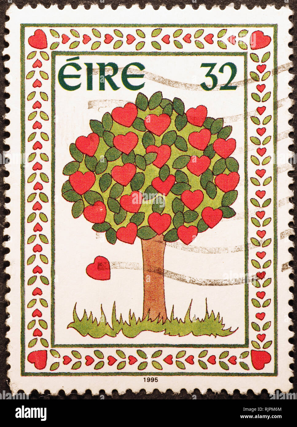 Tree producing hearts on irish postage stamp Stock Photo - Alamy