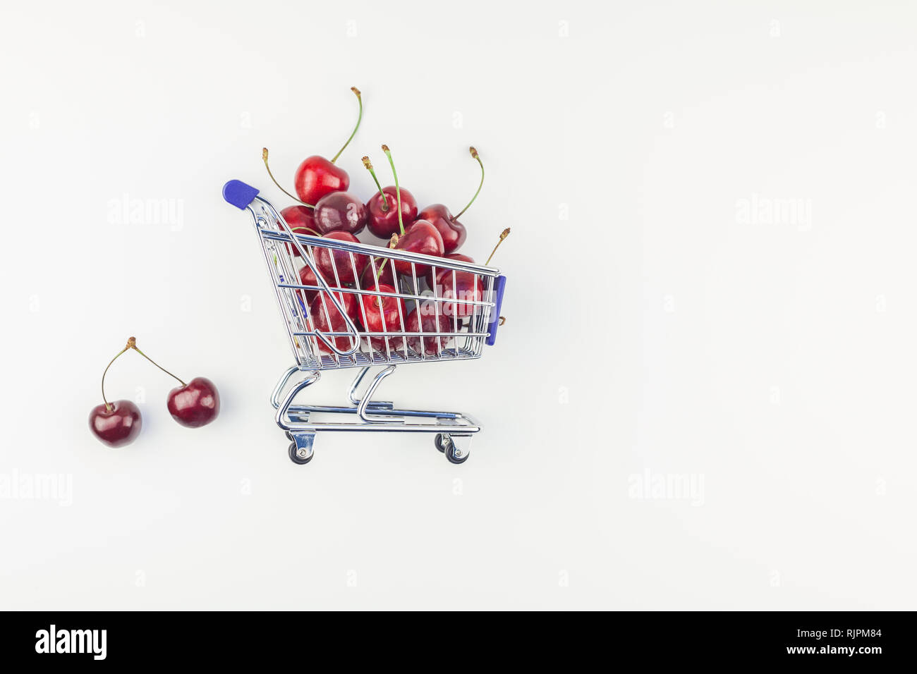Cherries in the shopping basket hi-res stock photography and images - Alamy