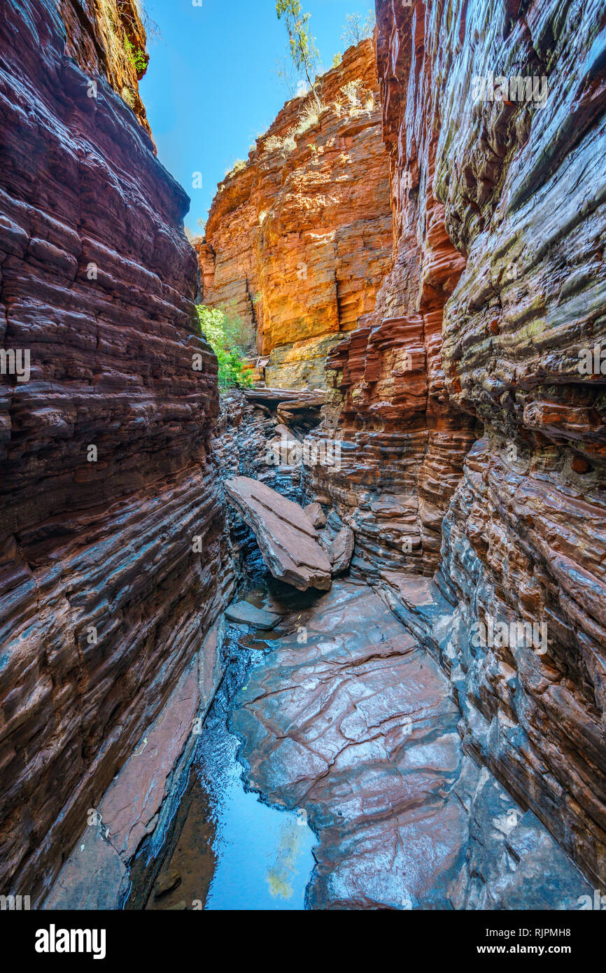 hiking down in the deep and narrow weano gorge in karijini national ...