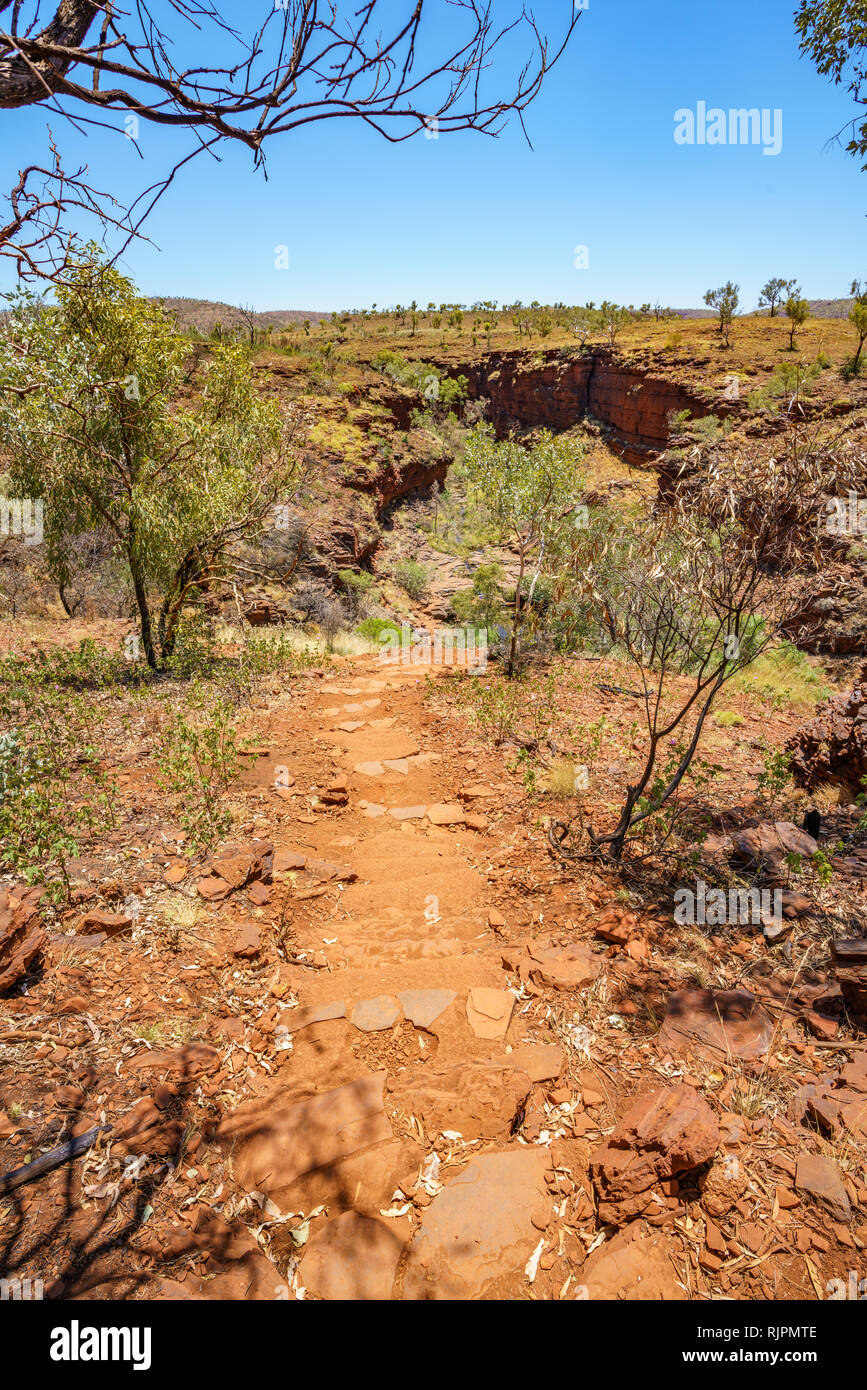 hiking down in the deep and narrow weano gorge in karijini national ...