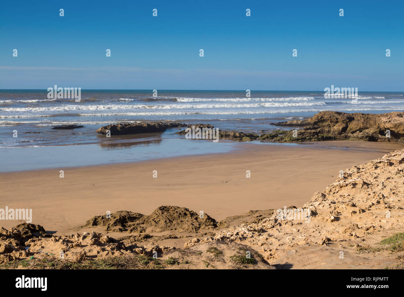 Golden sand and rocky beach of the Atlantic ocean in the north of ...